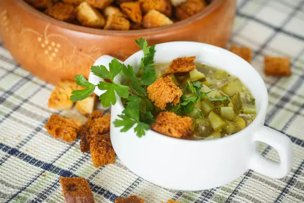 Vegetable soup with salty cucumbers