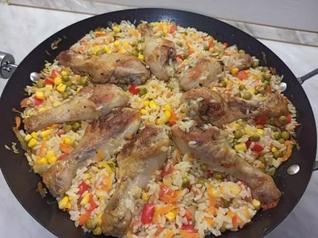 Chicken with rice and vegetables. Catalan rice