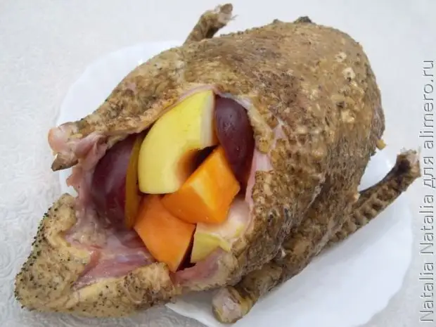 Duck stuffed with pumpkin with apples and baked in the oven - festive dish